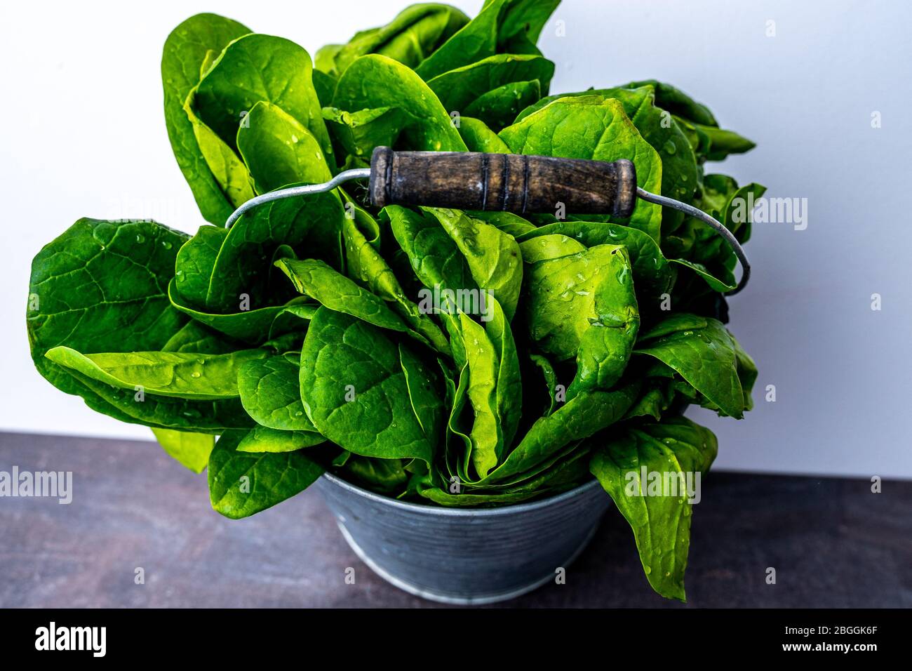 Top view of green spinach in metal bucket Stock Photo - Alamy