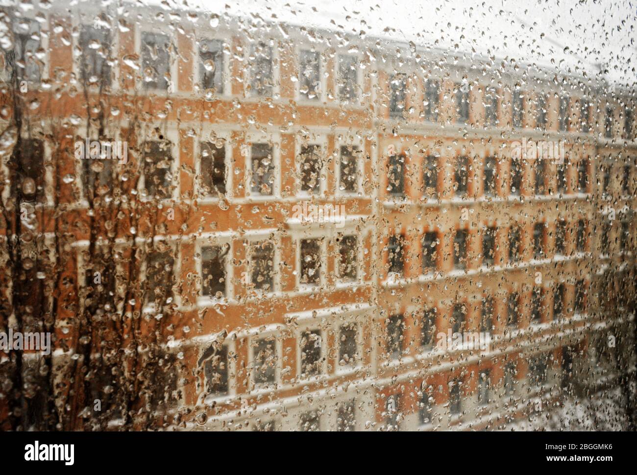 Bad weather, window view with raindrops and wet snow Stock Photo - Alamy