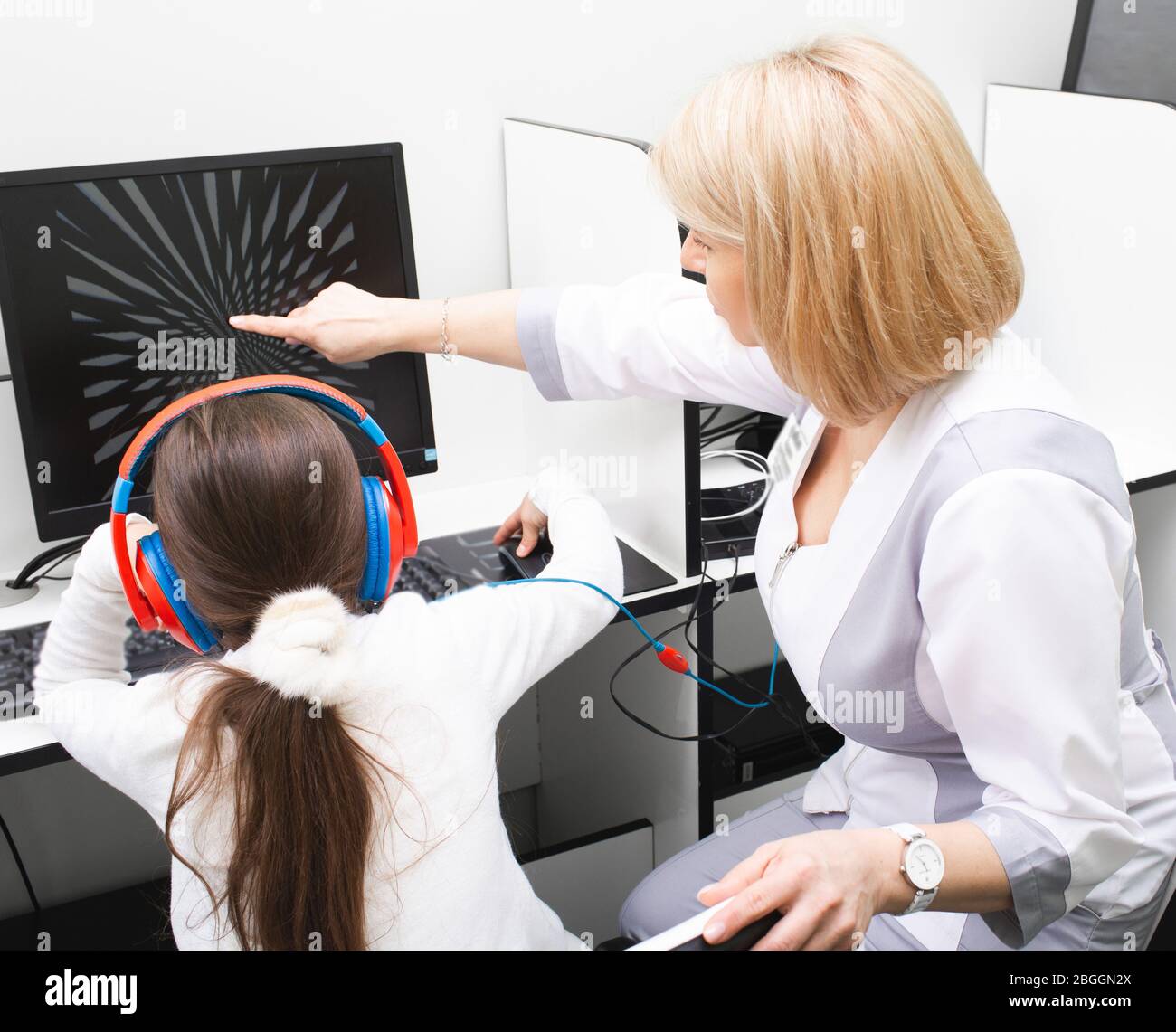 girl-receives-strabismus-treatment-amblyopia-treatment-woman-doctor