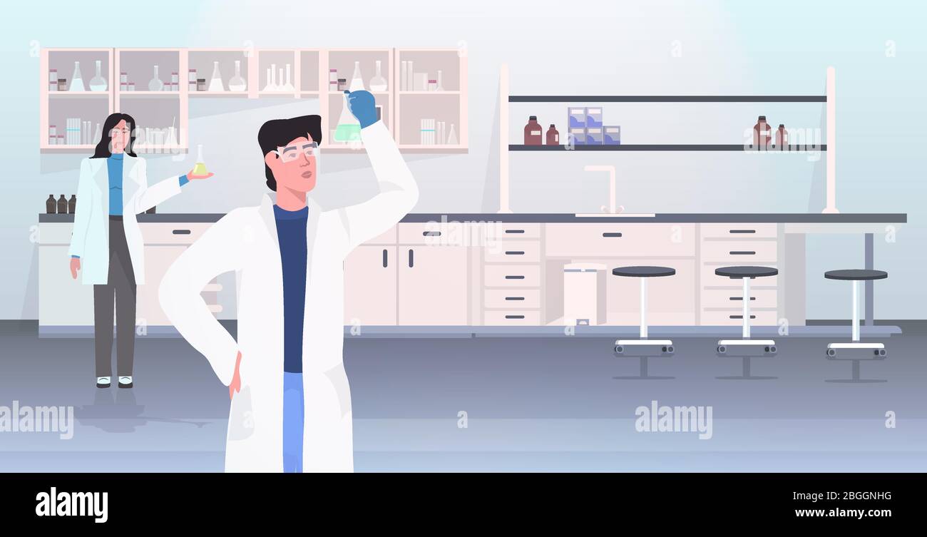 scientists couple holding test tubes working in medical lab man woman ...