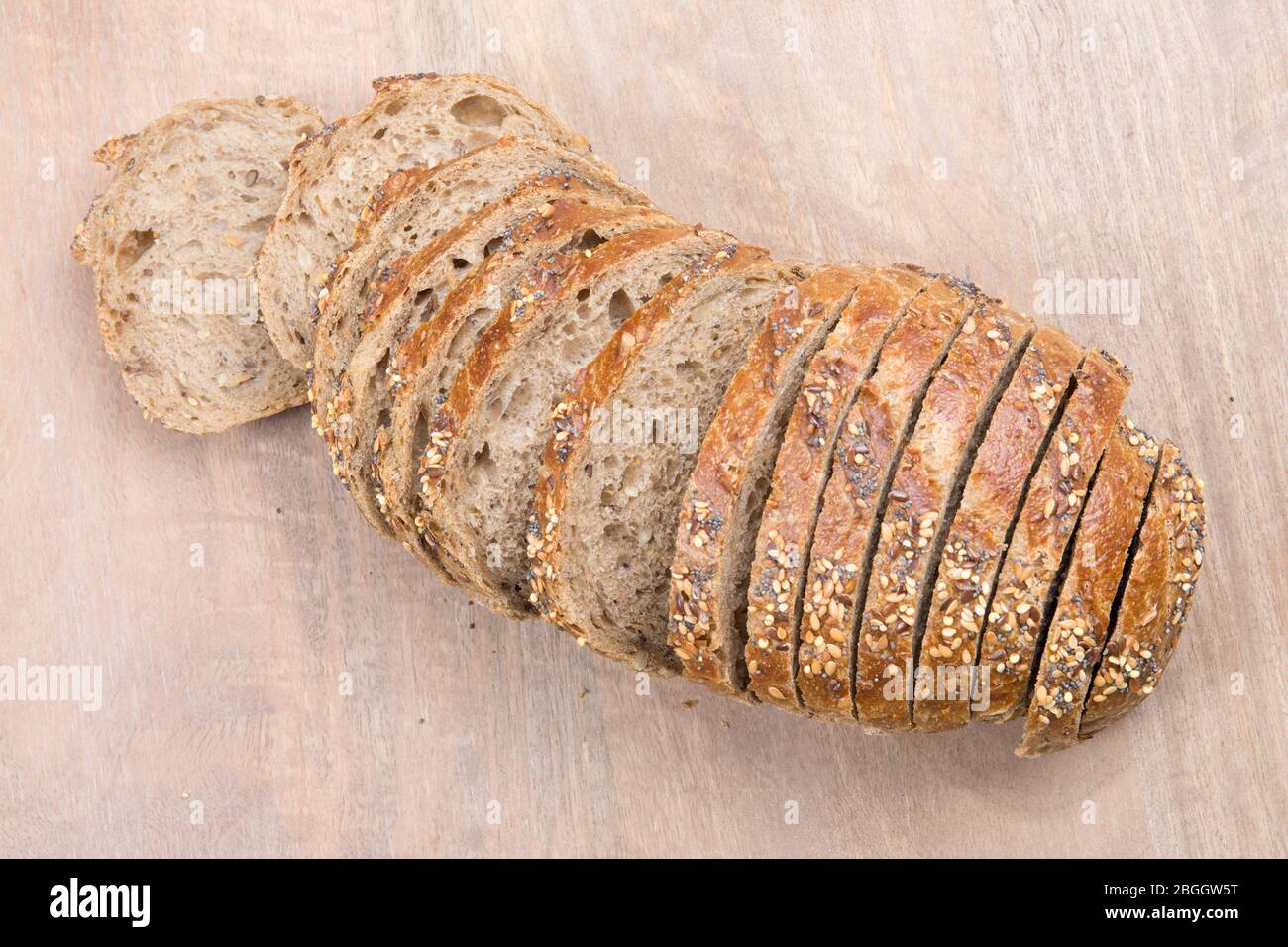 rye wholemeal bread in wood table background top view Stock Photo - Alamy