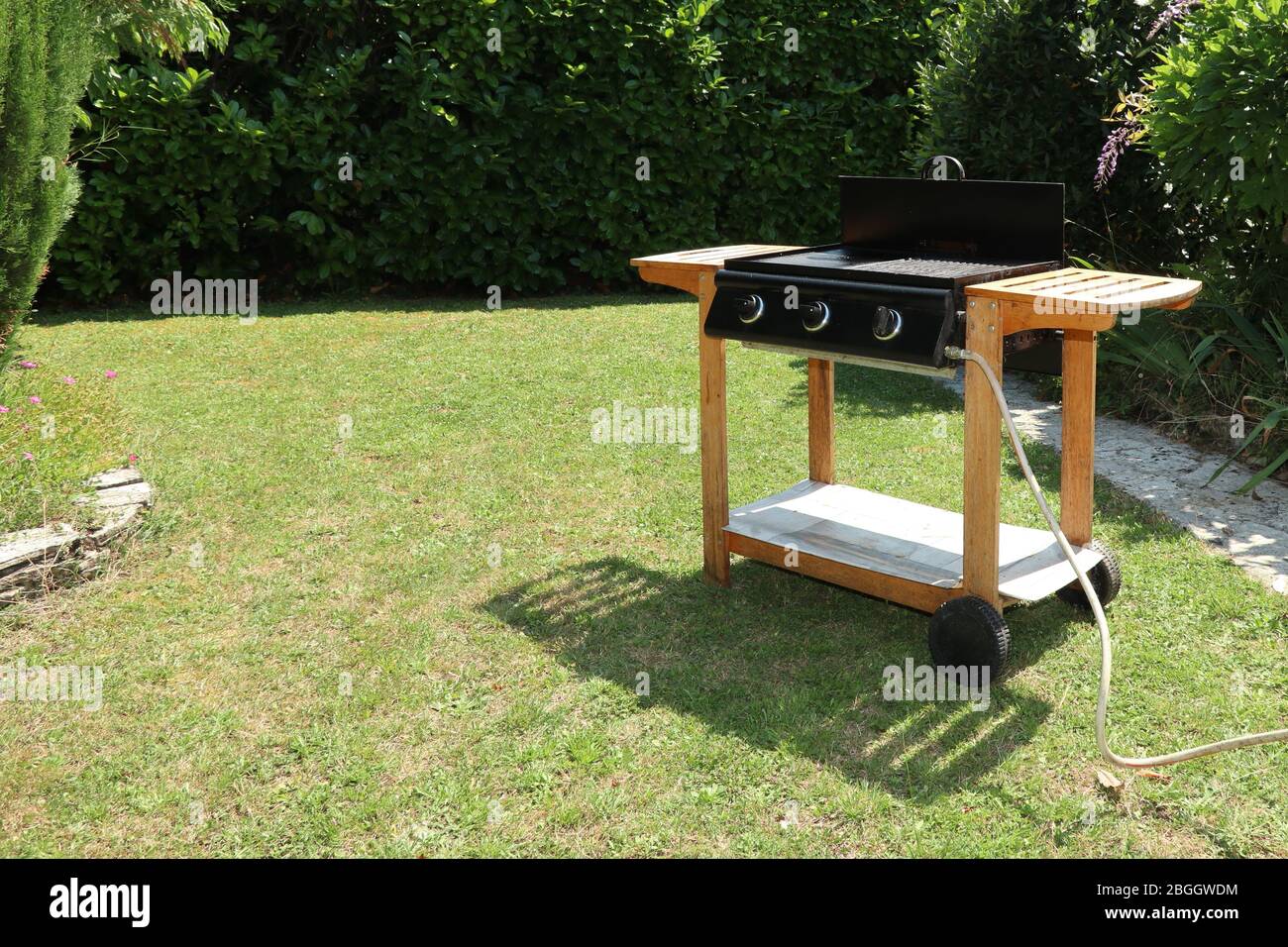 barbecue griddle by gas installed in garden Stock Photo - Alamy