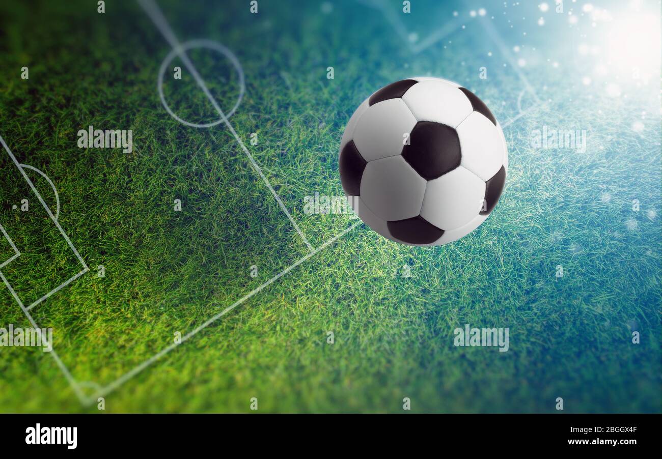 Soccer ball on green stadium with white layout. Bright spotlight ...
