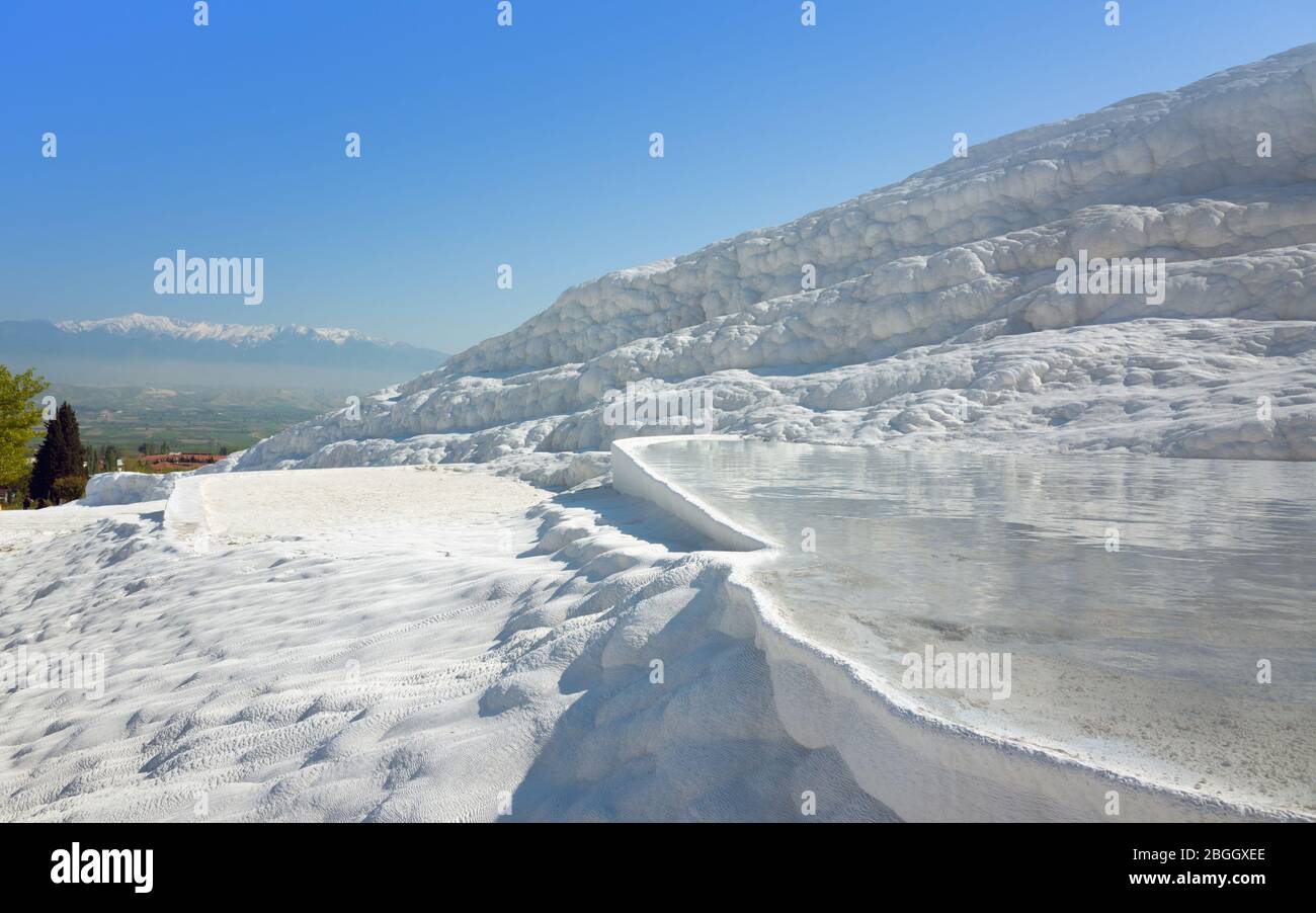 Amazing white travertine terrace formations, pool with clear hot water ...