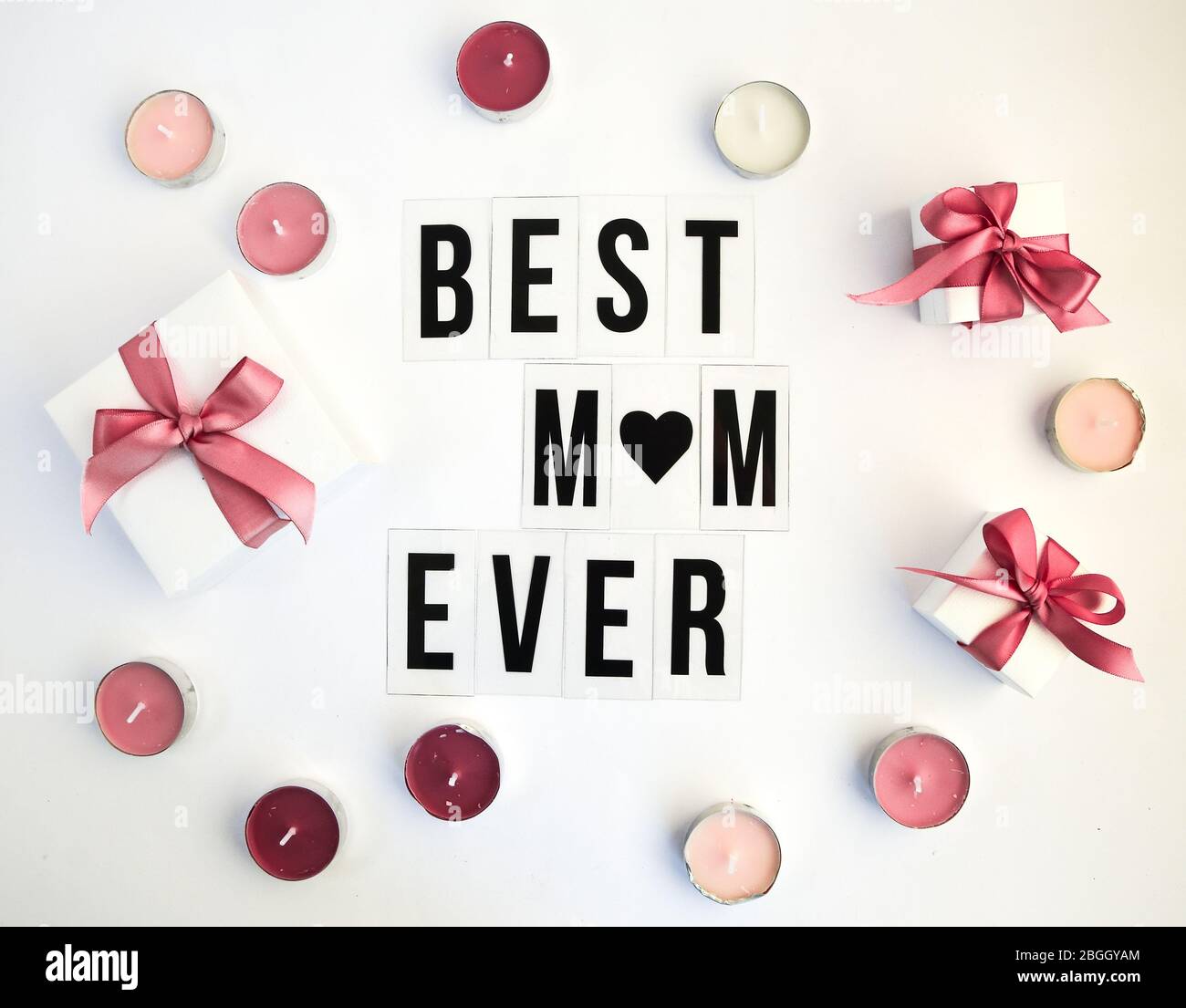 BEST MOM EVER text on white table background, with gift boxes and ...
