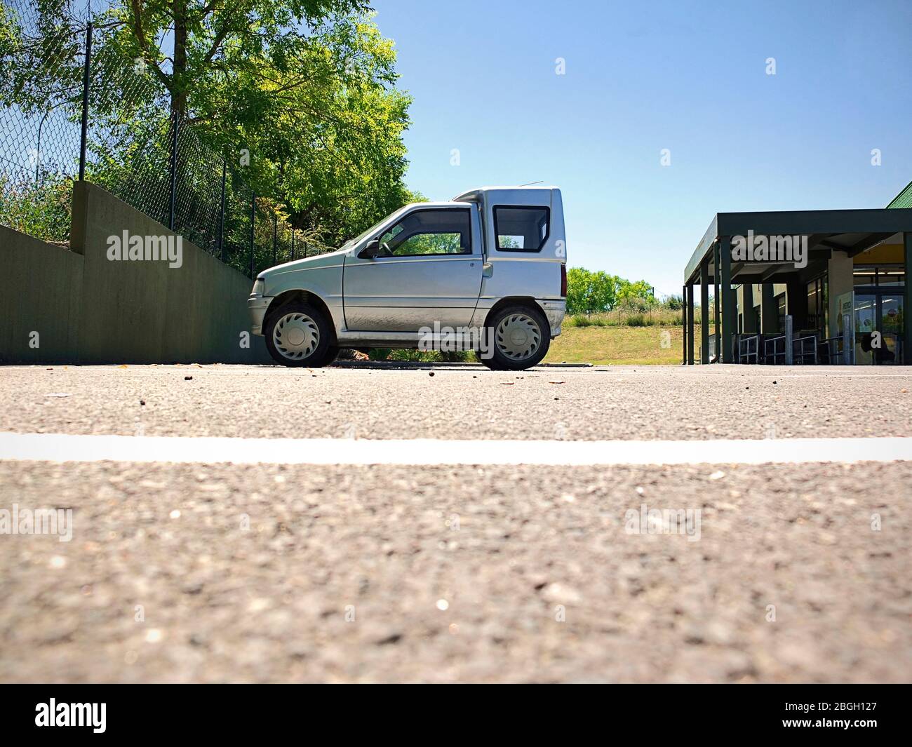 Side Profile of Compact Car in Parking Lot Stock Photo - Alamy