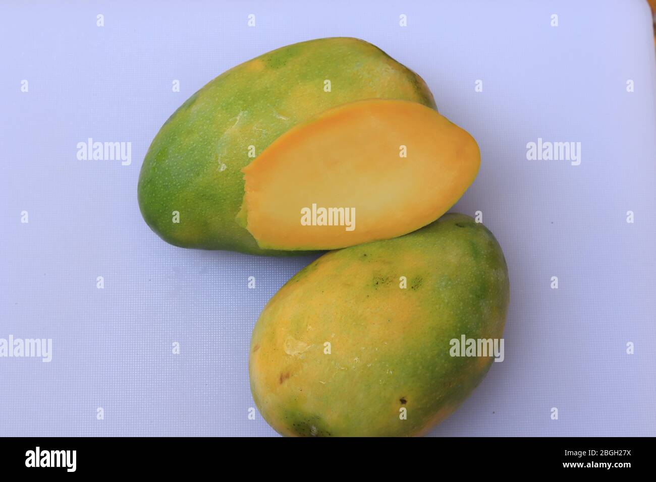 Fresh Yellow Mango fruit isolated on white background Stock Photo - Alamy