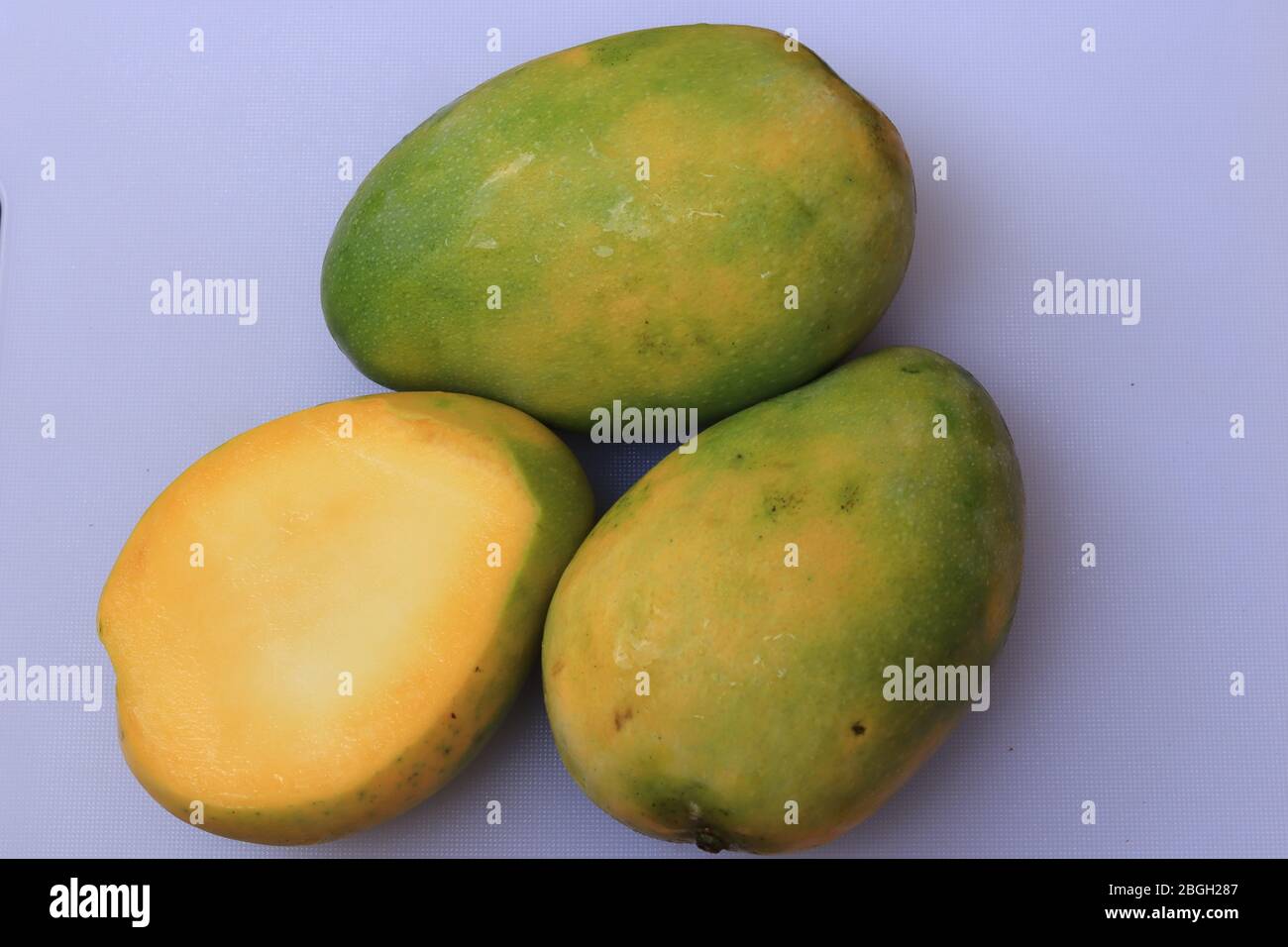 Fresh Yellow Mango fruit isolated on white background Stock Photo - Alamy