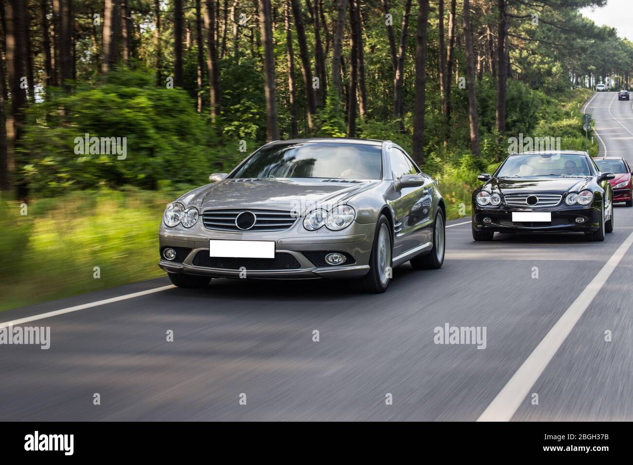 Chasing cars landscape drive in the sunset Stock Photo - Alamy