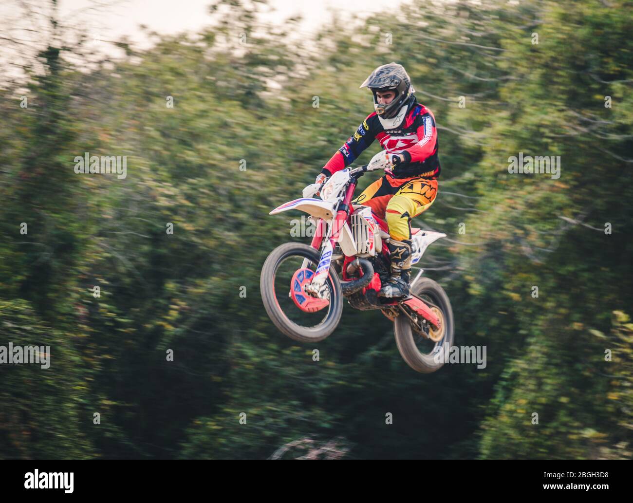 Biker jumping in his motorcycle high Stock Photo - Alamy