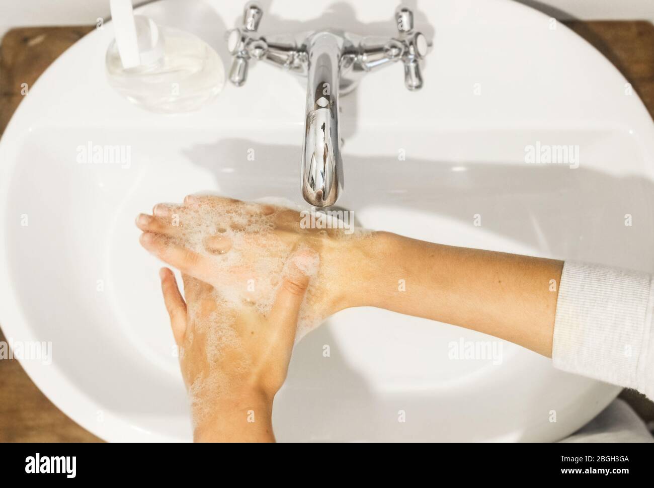 Rubbing big thumb top view, Washing hands with antibacterial soap in ...