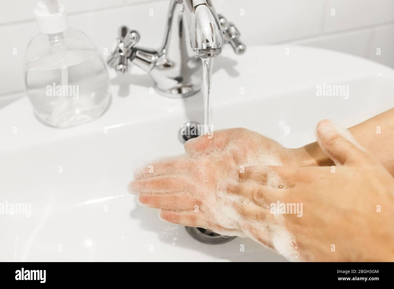Washing hands. Rubbing palms, washing hands with antibacterial soap and ...