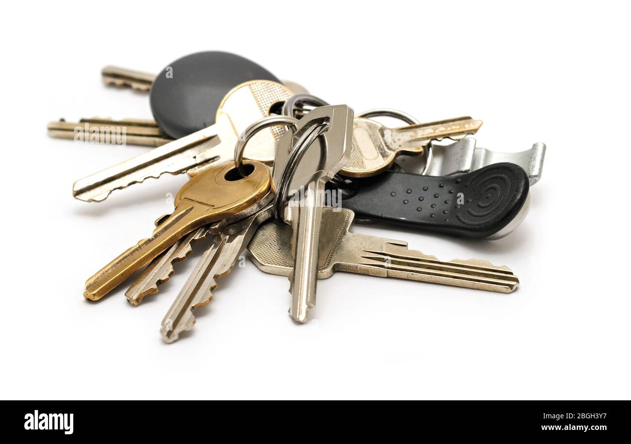 Big bunch of keys and chips over white background Stock Photo - Alamy