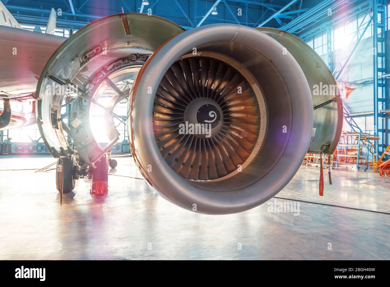 Industrial view of an airplane engine with an open hood for repair in ...