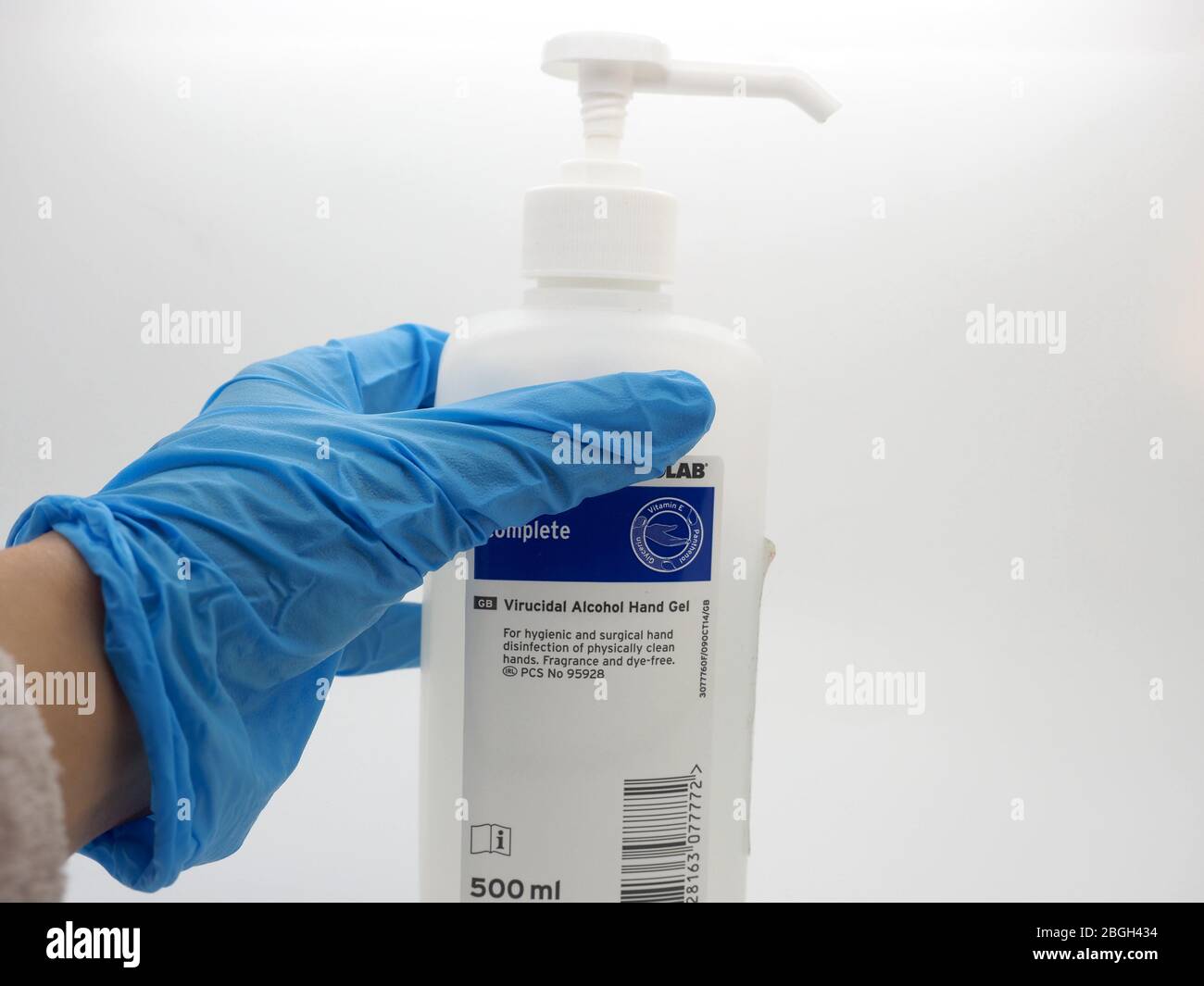 Hand wearing plastic glove picking hi-res stock photography and images ...