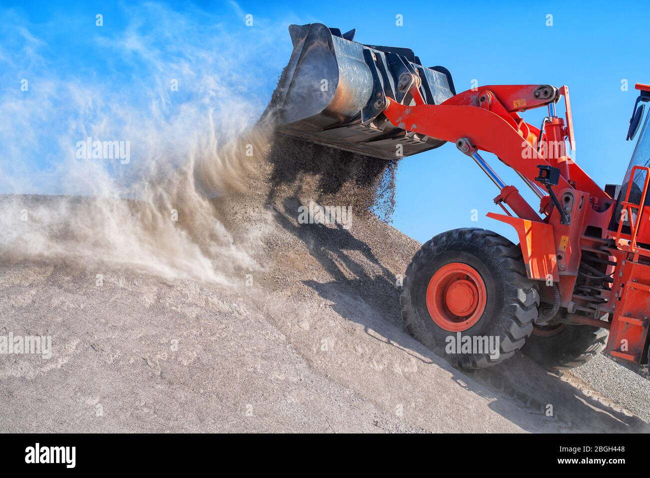 Mining industry. heavy wheel loader loading granite rock or ore at ...