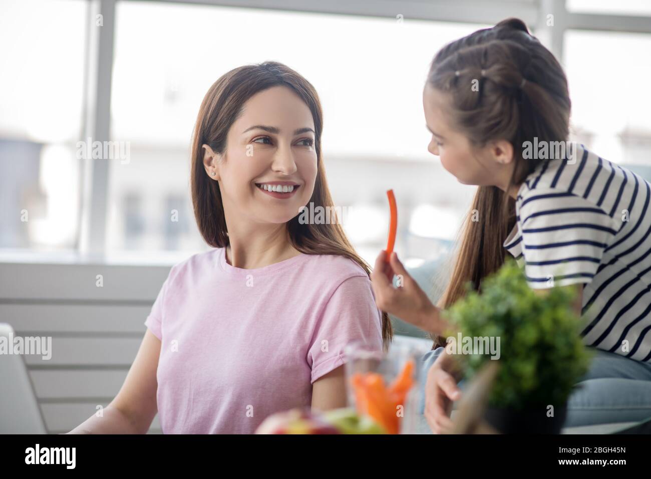 Giving carrot hi-res stock photography and images - Alamy