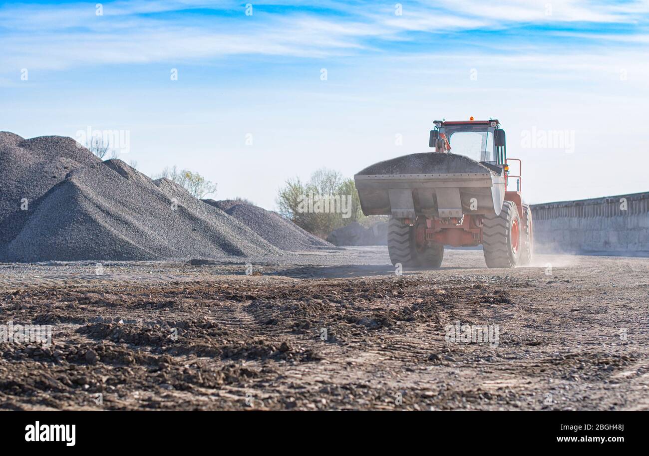 Mining industry. heavy wheel loader loading granite rock or ore at ...