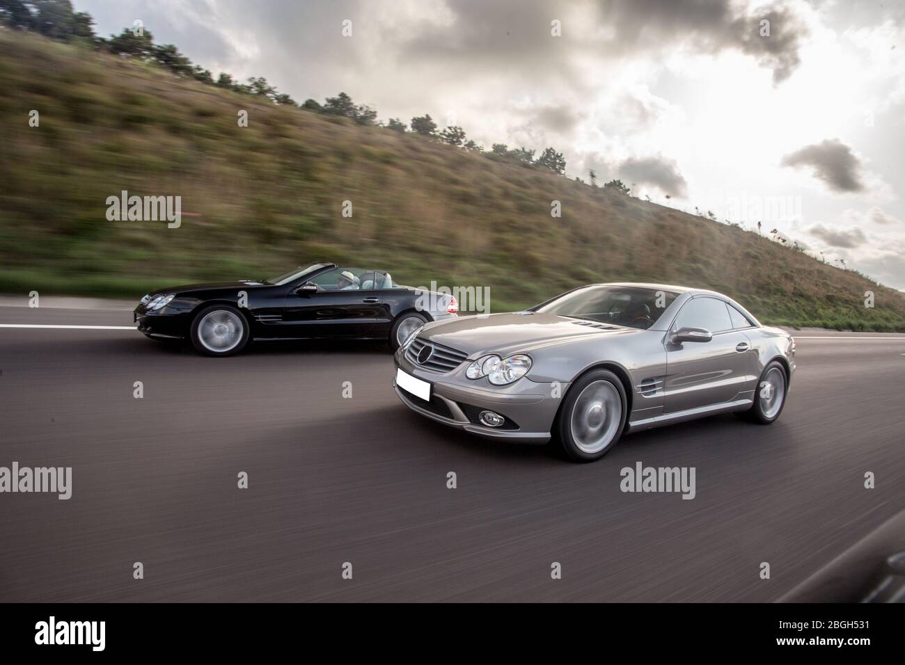 Drone chasing white car driving hi-res stock photography and images - Alamy