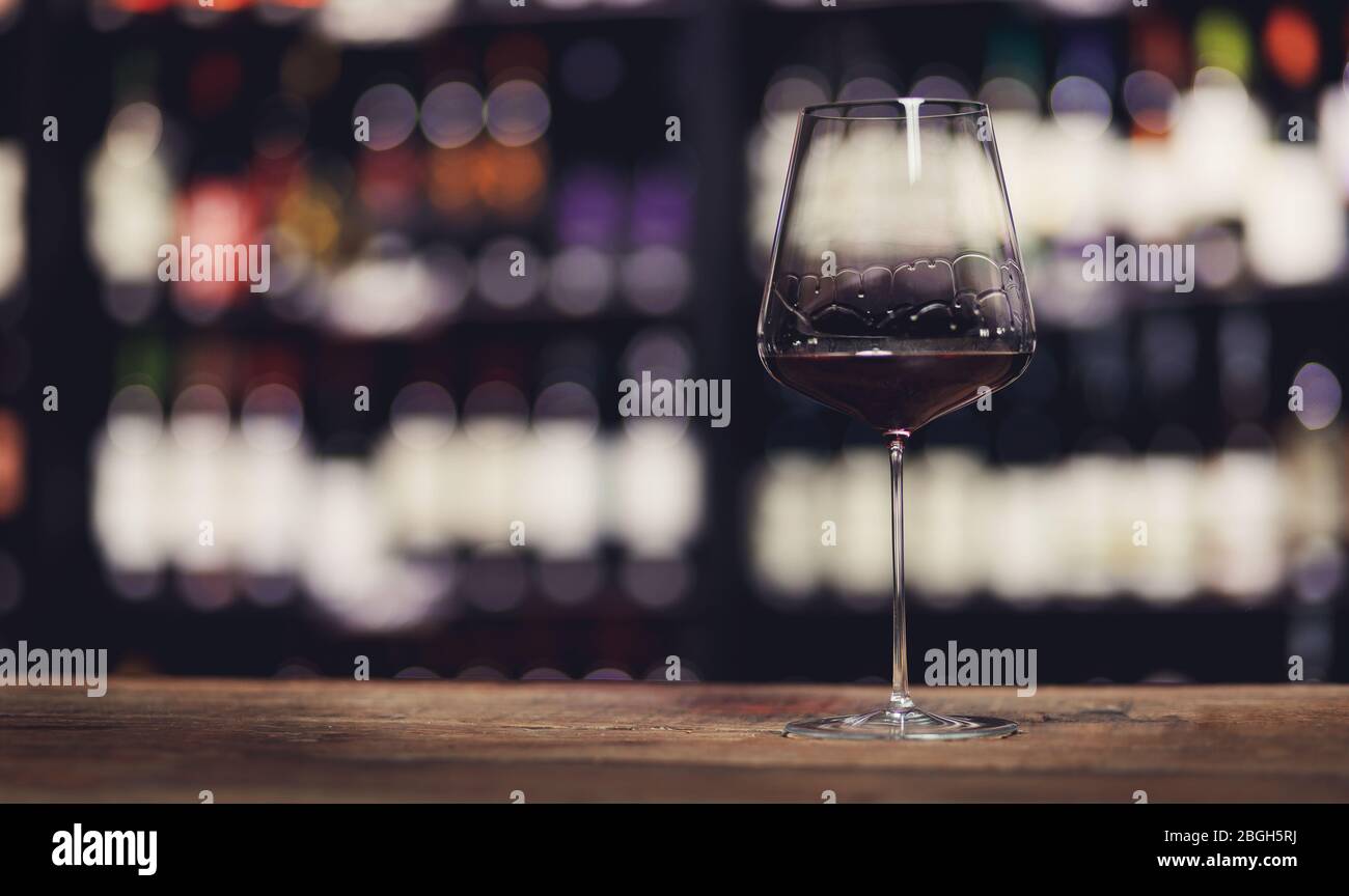 Glass of red wine on wooden bar counter in restaurant, copy space Stock ...
