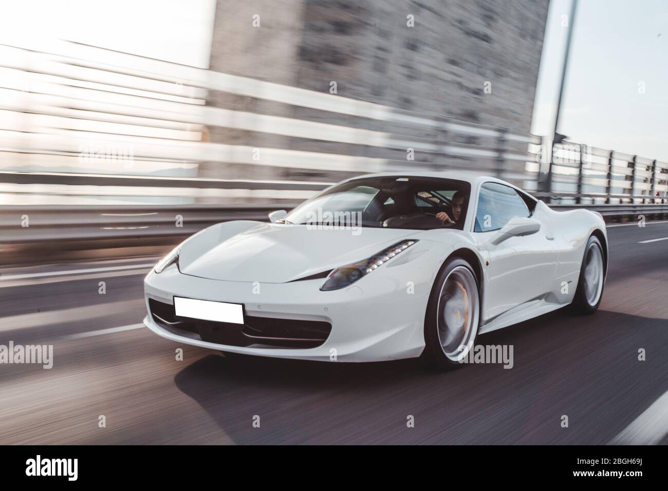 White luxury sport car test drive Stock Photo - Alamy