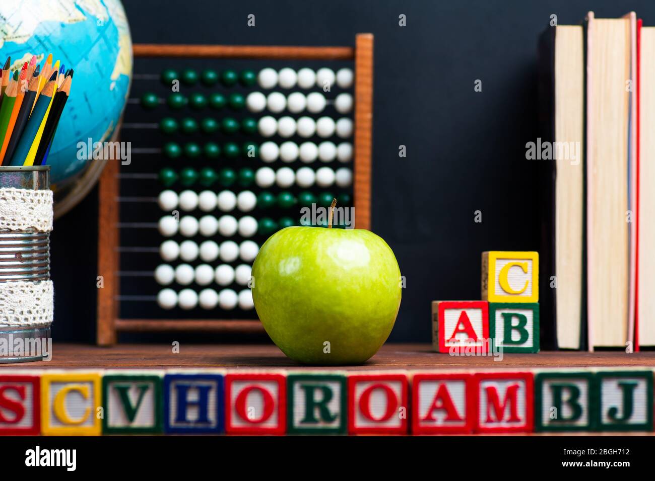 School and education accessories in front of the blackboard in the ...