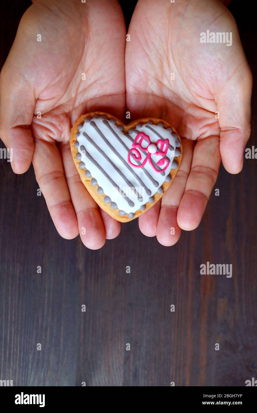Hand offering heart symbol hi-res stock photography and images - Alamy