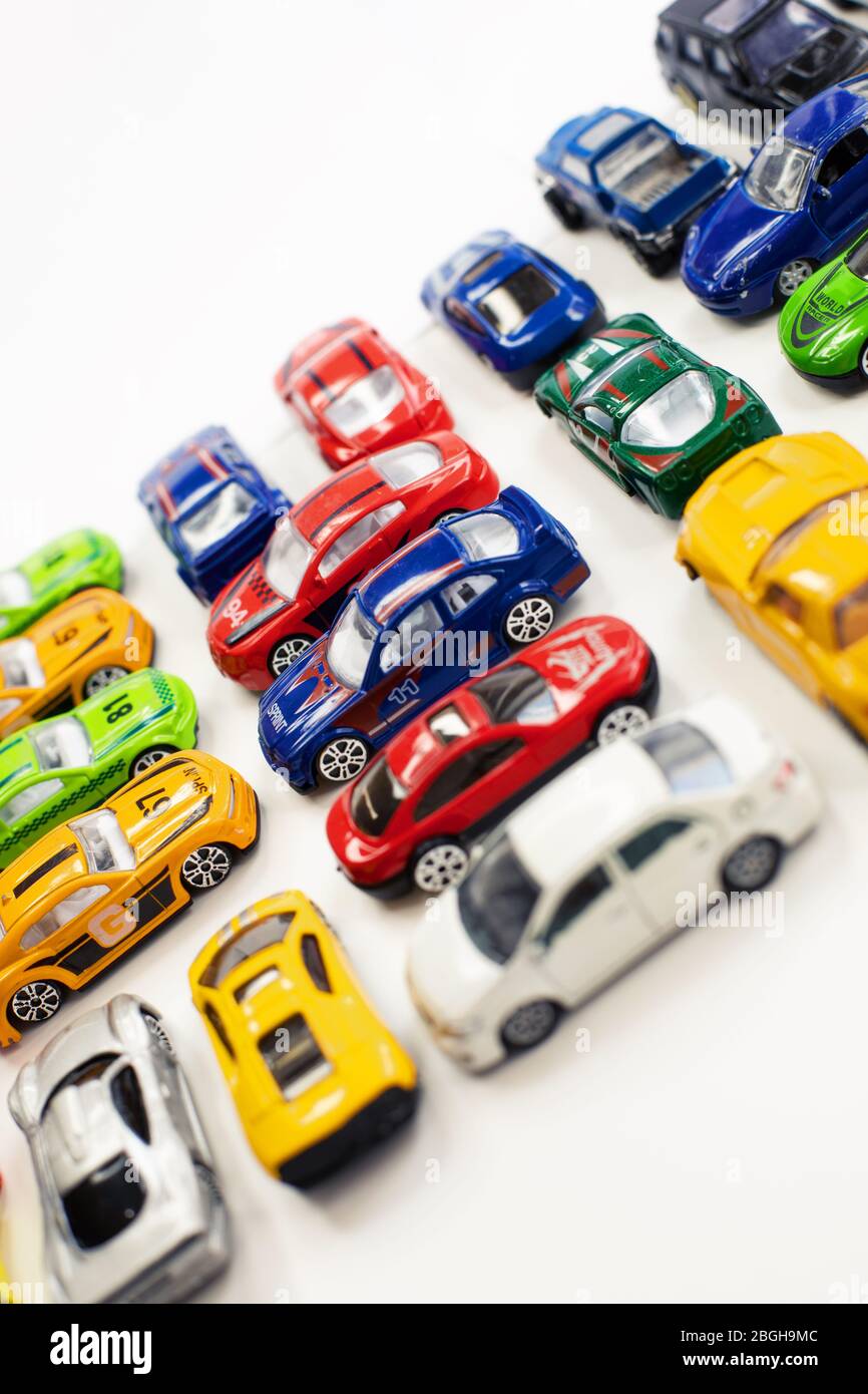 Toy cars of different colors arranged on a white background Stock Photo ...