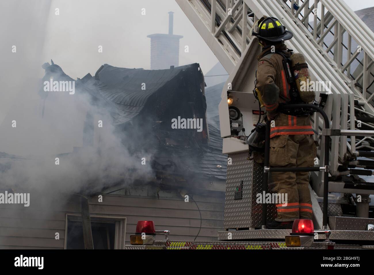 Ontario, Canada April 20 2020: Smoking house on fire with extreme ...