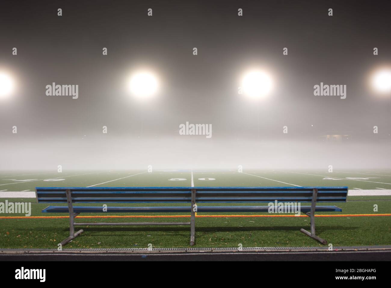 The green grass field of football field in the fog hi-res stock ...
