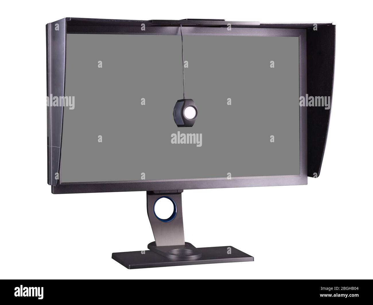 Professional monitor with shading hood and calibrator isolated on white ...