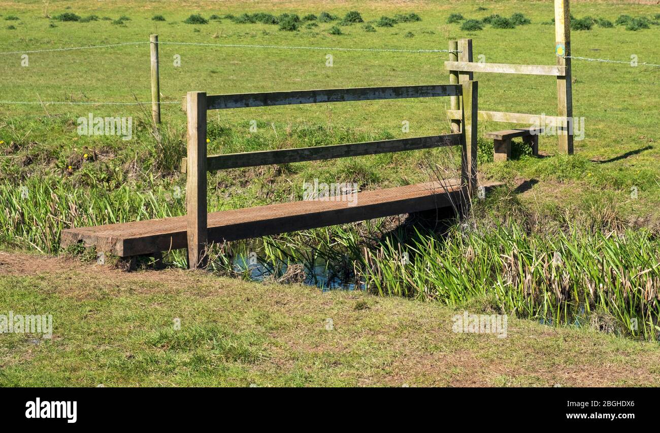Short wooden footbridge spanning a ditch Stock Photo - Alamy