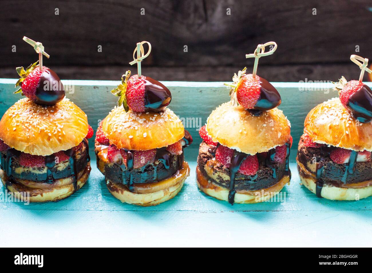 Sweet burgers with brioche bun, chocolate brownie layer, fresh ...