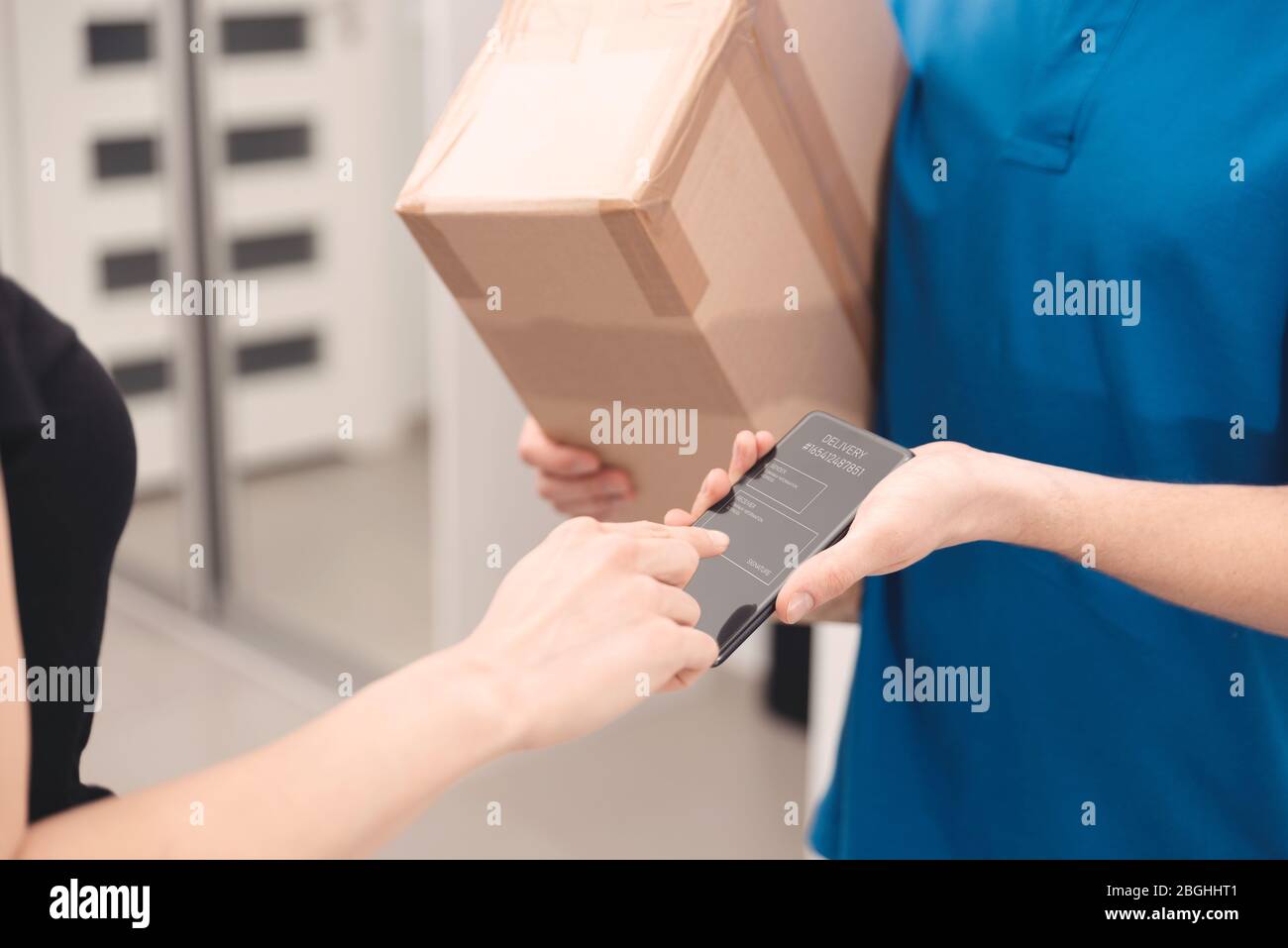 Courier delivery service. Customer receives the parcel on phone Stock ...