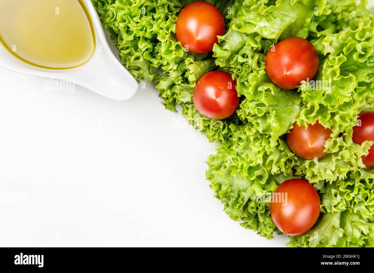 Vegetable still life. Lettuce, tomatoes and olive oil. Top view Stock ...