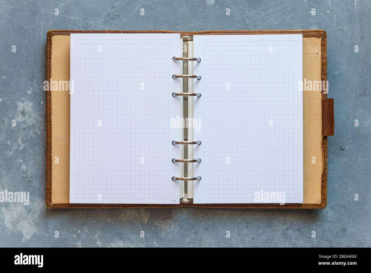 Note book and note paper on a grown background Stock Photo - Alamy