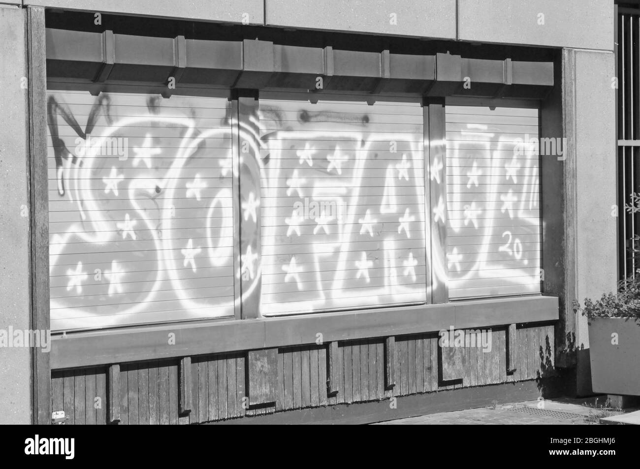 Graffiti on shop window Black and White Stock Photos & Images - Alamy