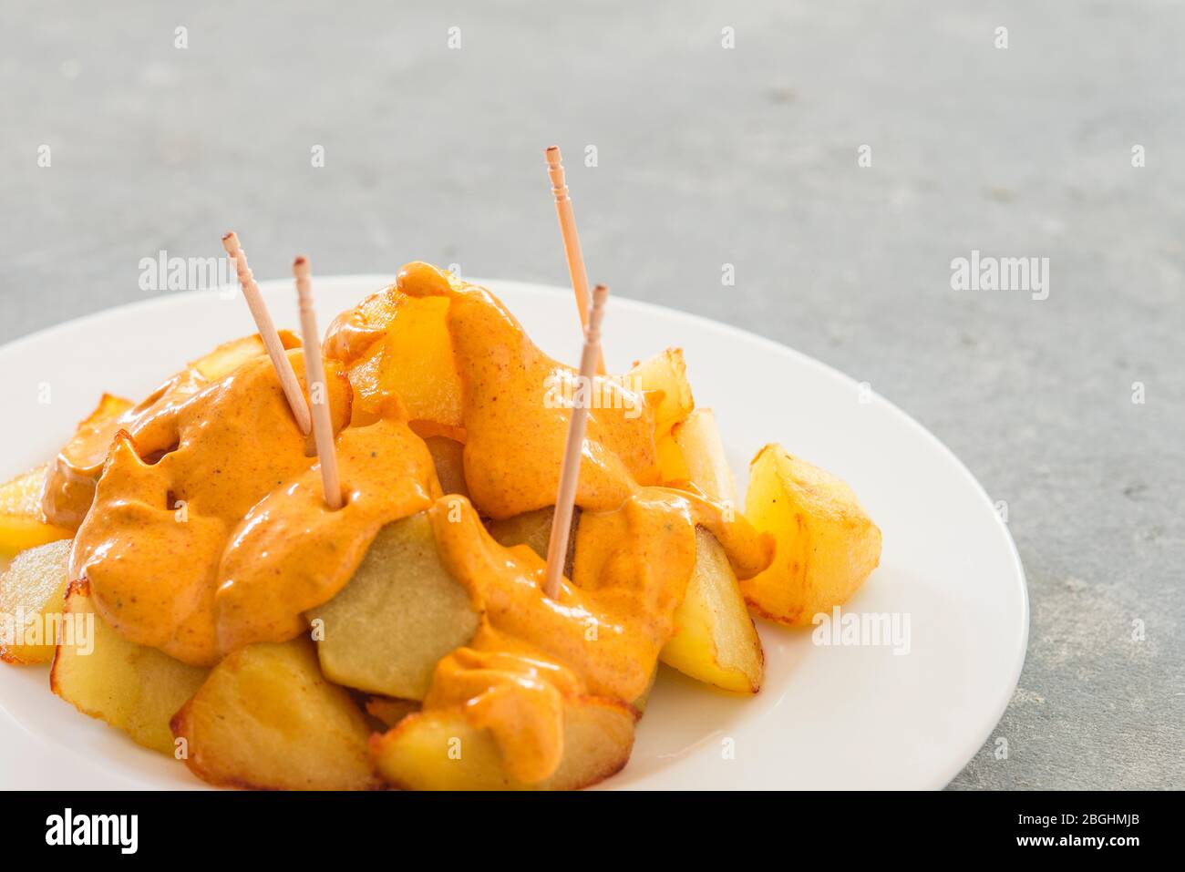 Patatas bravas traditional Spanish potatoes snack tapas Stock Photo - Alamy