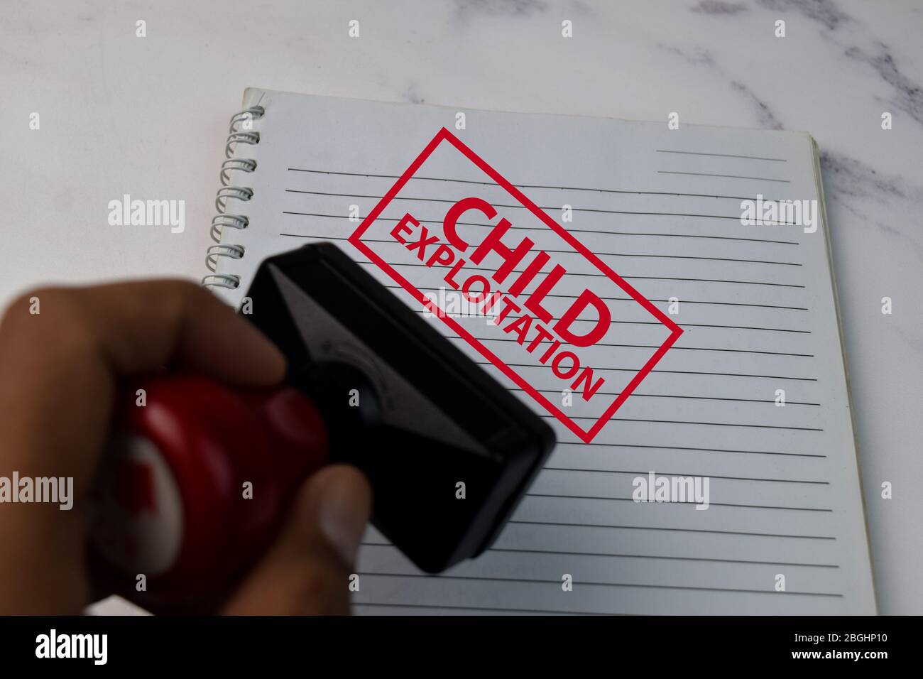 Red Handle Rubber Stamper and Child Exploitation text isolated on White ...