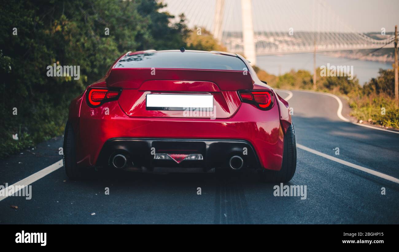 Modern red racing car commercial with panoramic view Stock Photo - Alamy