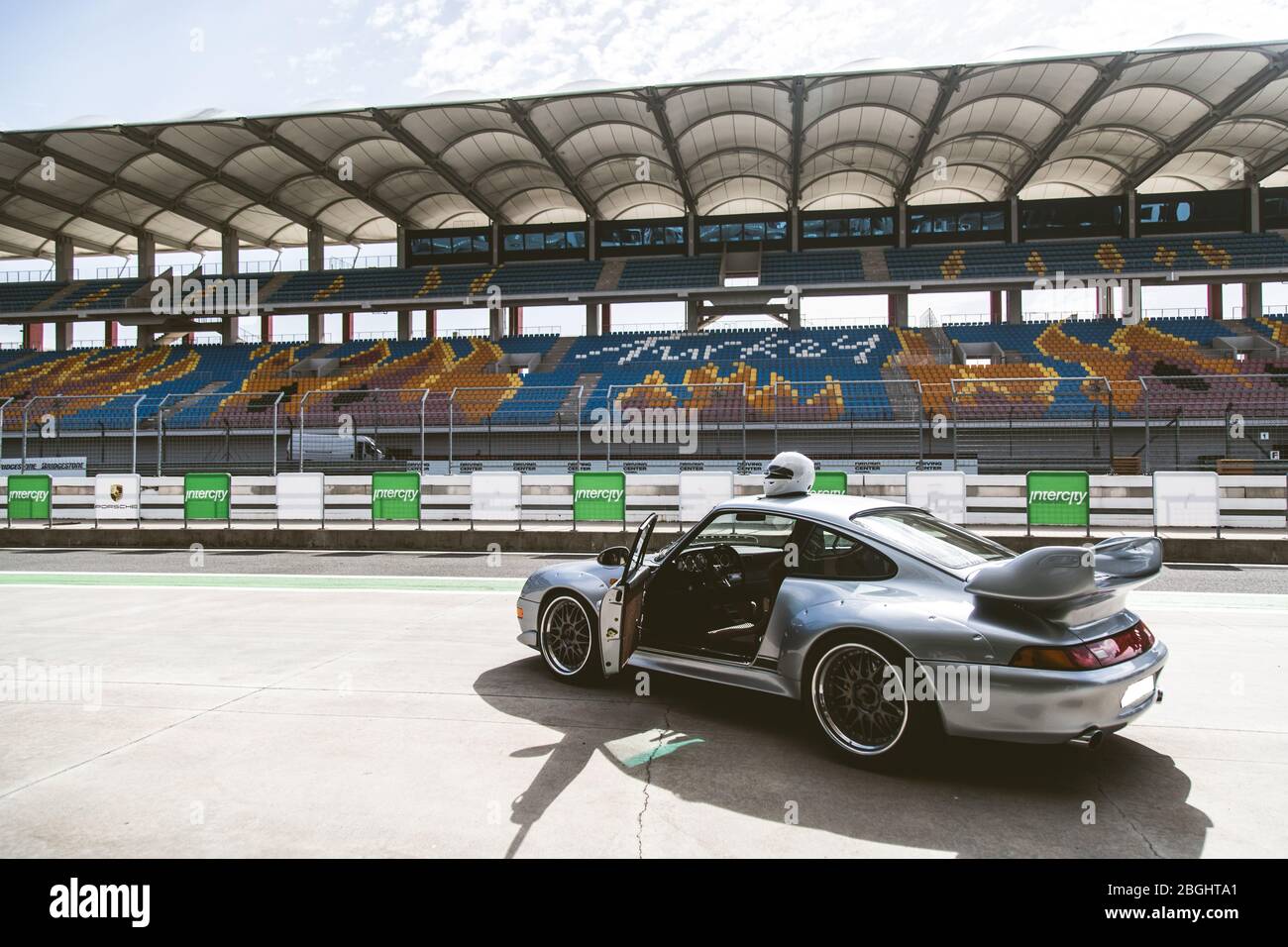 A silver sport car in the racing stadium area Stock Photo - Alamy