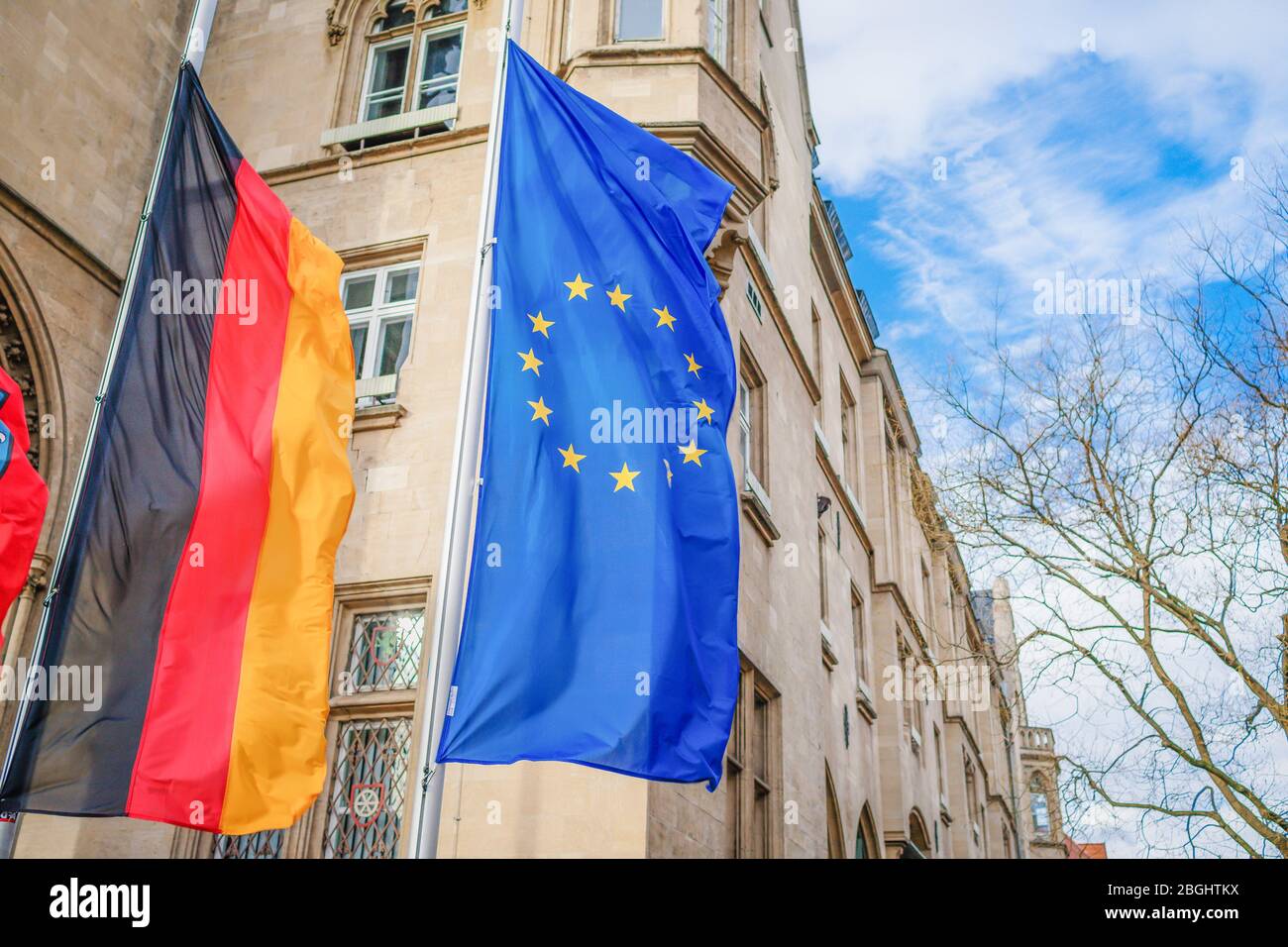 Vertical European Union flag and flag of Germany on the german city ...