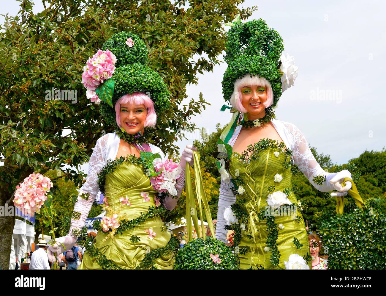 Two ladies in flower costumes at the Southport Flower Show Stock Photo ...