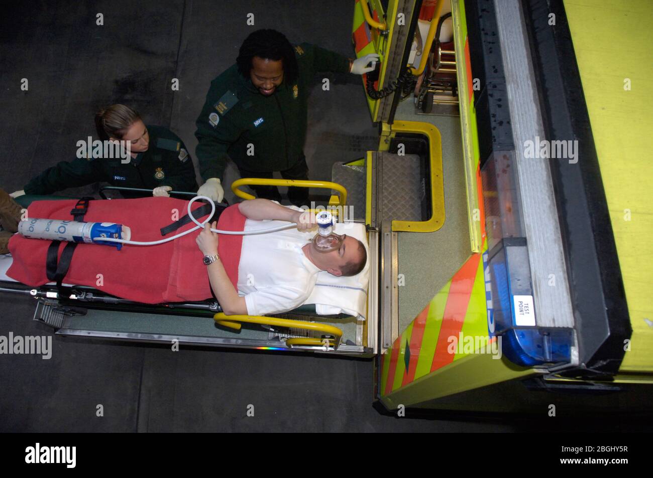 Paramedic monitors a patient as he breathes pure oxygen Stock Photo - Alamy