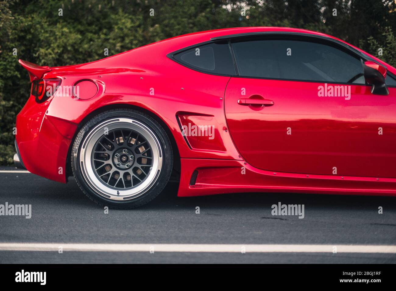 Modern red racing car commercial Stock Photo - Alamy