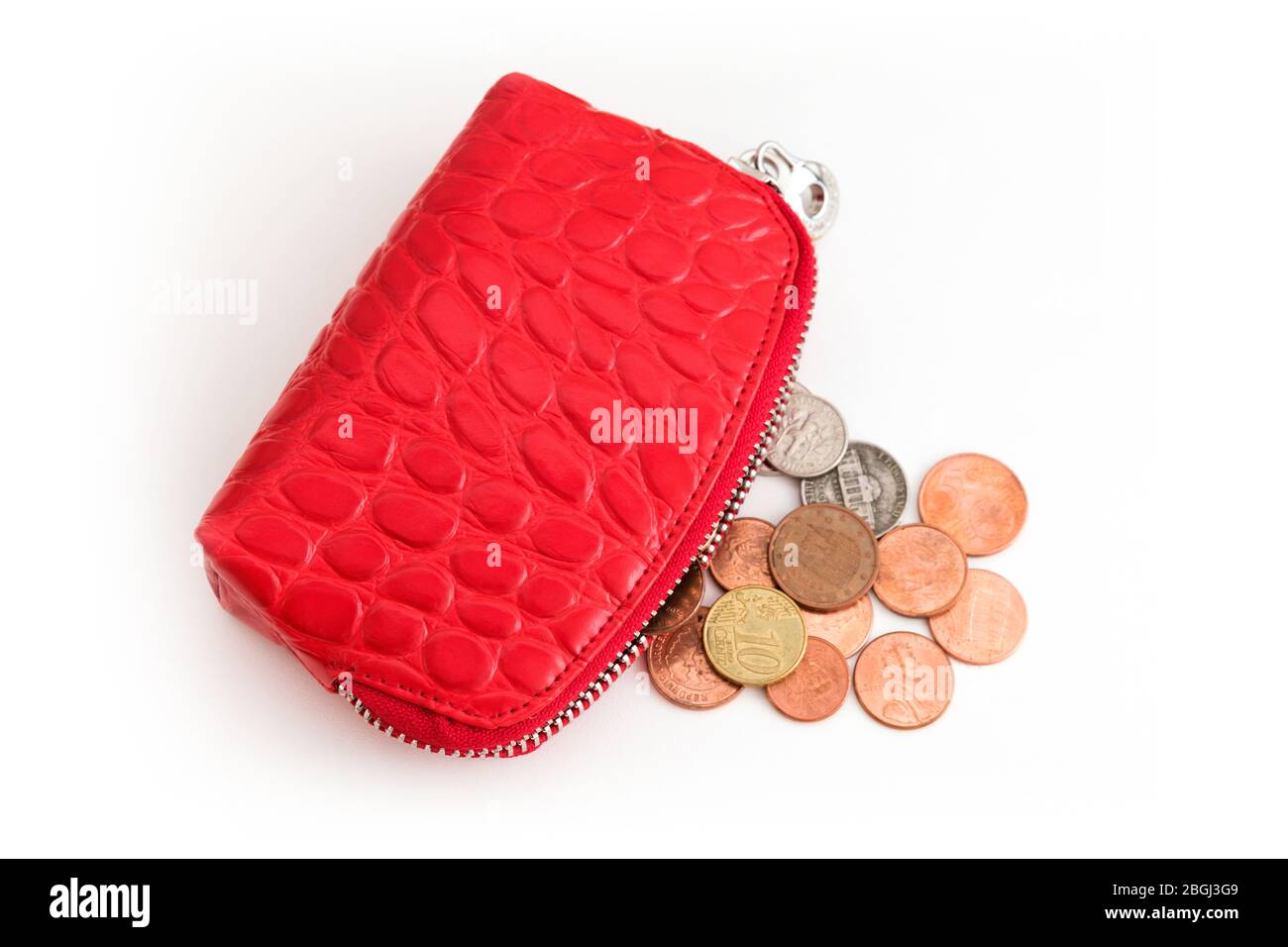 Red coin purse with coins in a white background. Photo with copy space ...