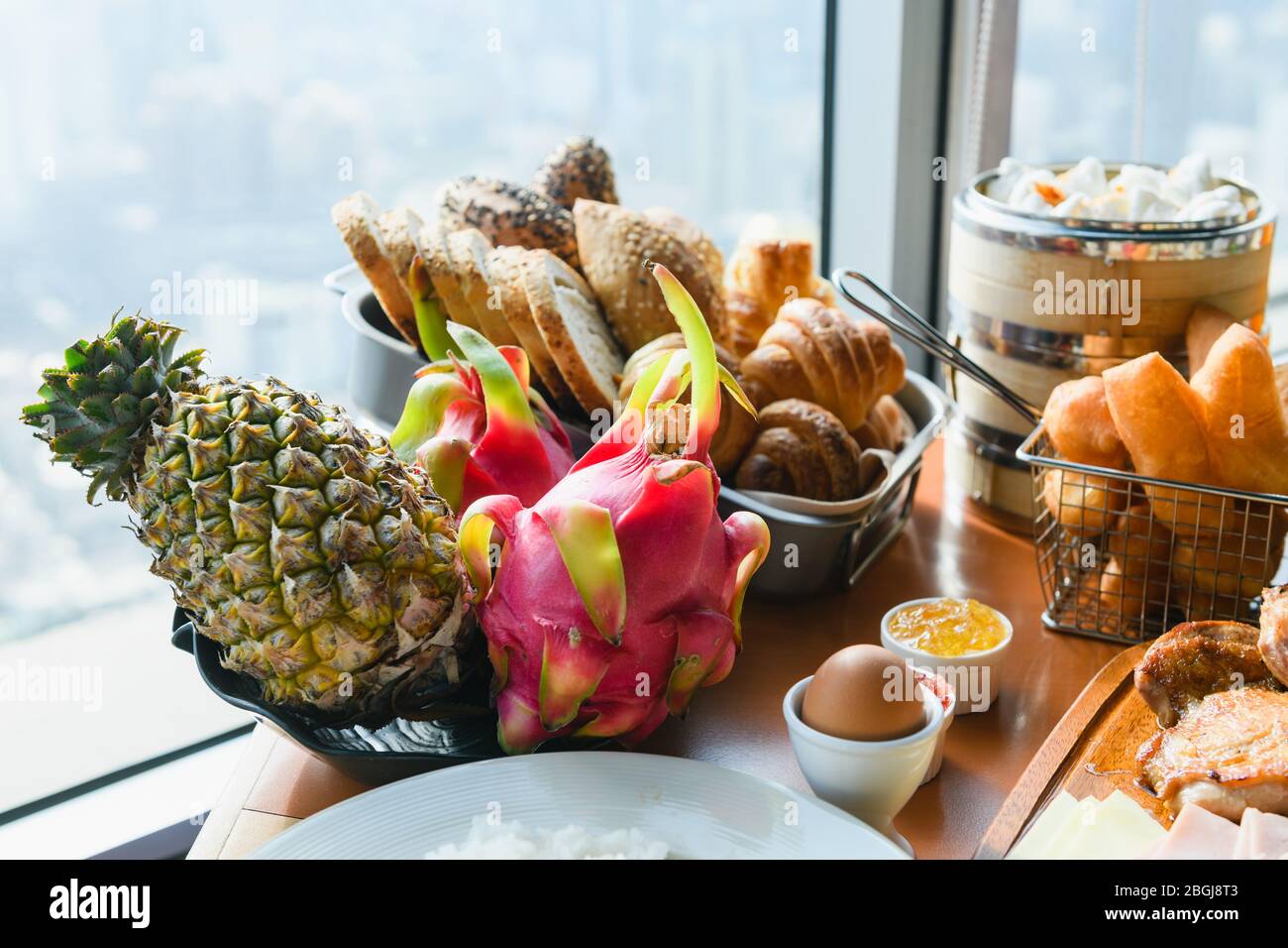 Fruits and bakery plates at buffet table Stock Photo - Alamy