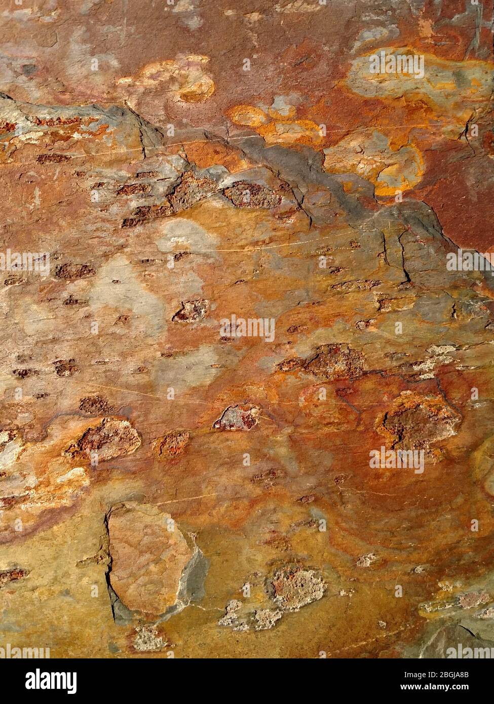 Surface of slate rocks embedded in an urban wall Stock Photo - Alamy