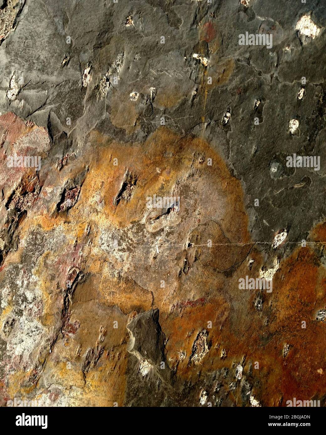 Surface of slate rocks embedded in an urban wall Stock Photo - Alamy