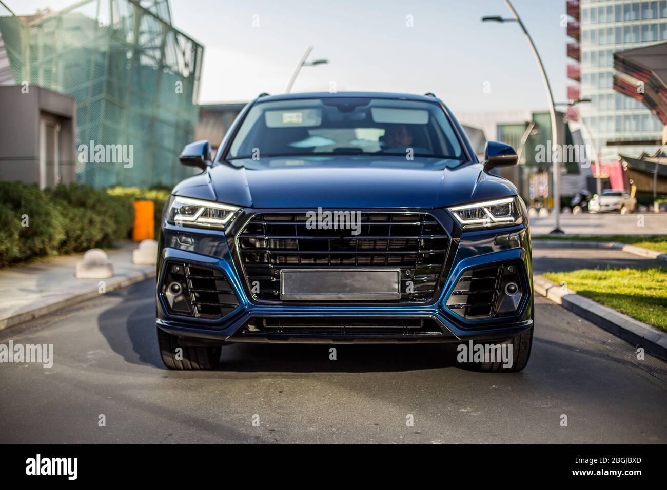 Blue van with red xenon lights in the parking, front view Stock Photo ...
